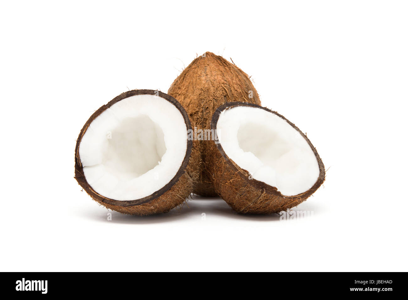 coconut cut in half on white background Stock Photo - Alamy