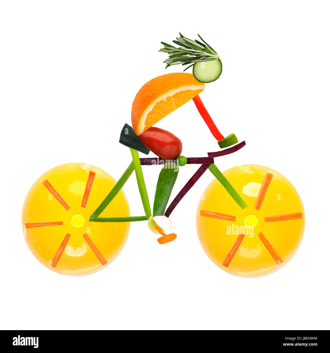 Fruits and vegetables in the shape of a male cyclist on a road bike ...