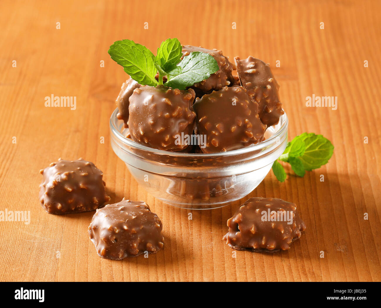 Chocolate pralines with chopped nuts Stock Photo - Alamy