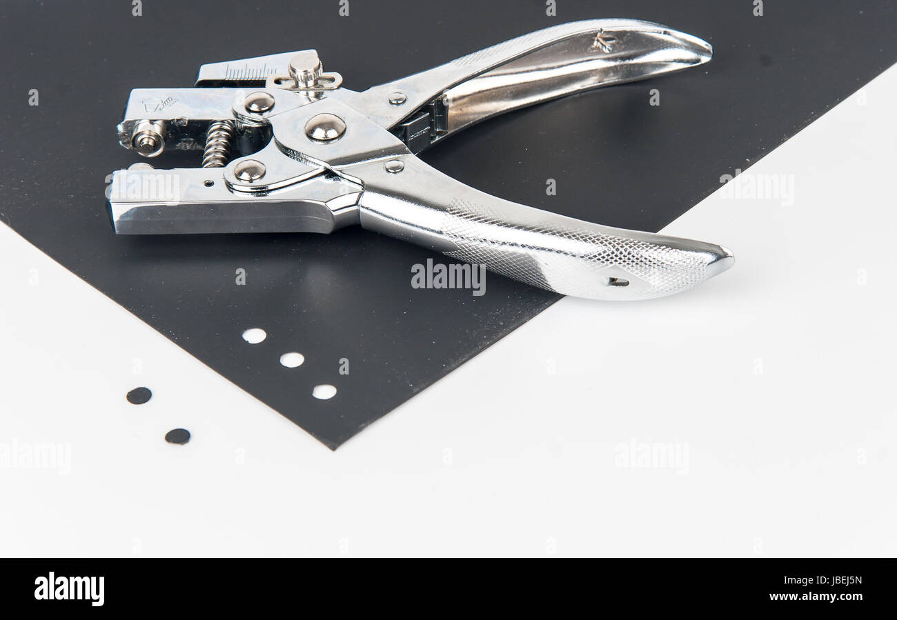 Office Puncher Unit isolated on white background Stock Photo - Alamy