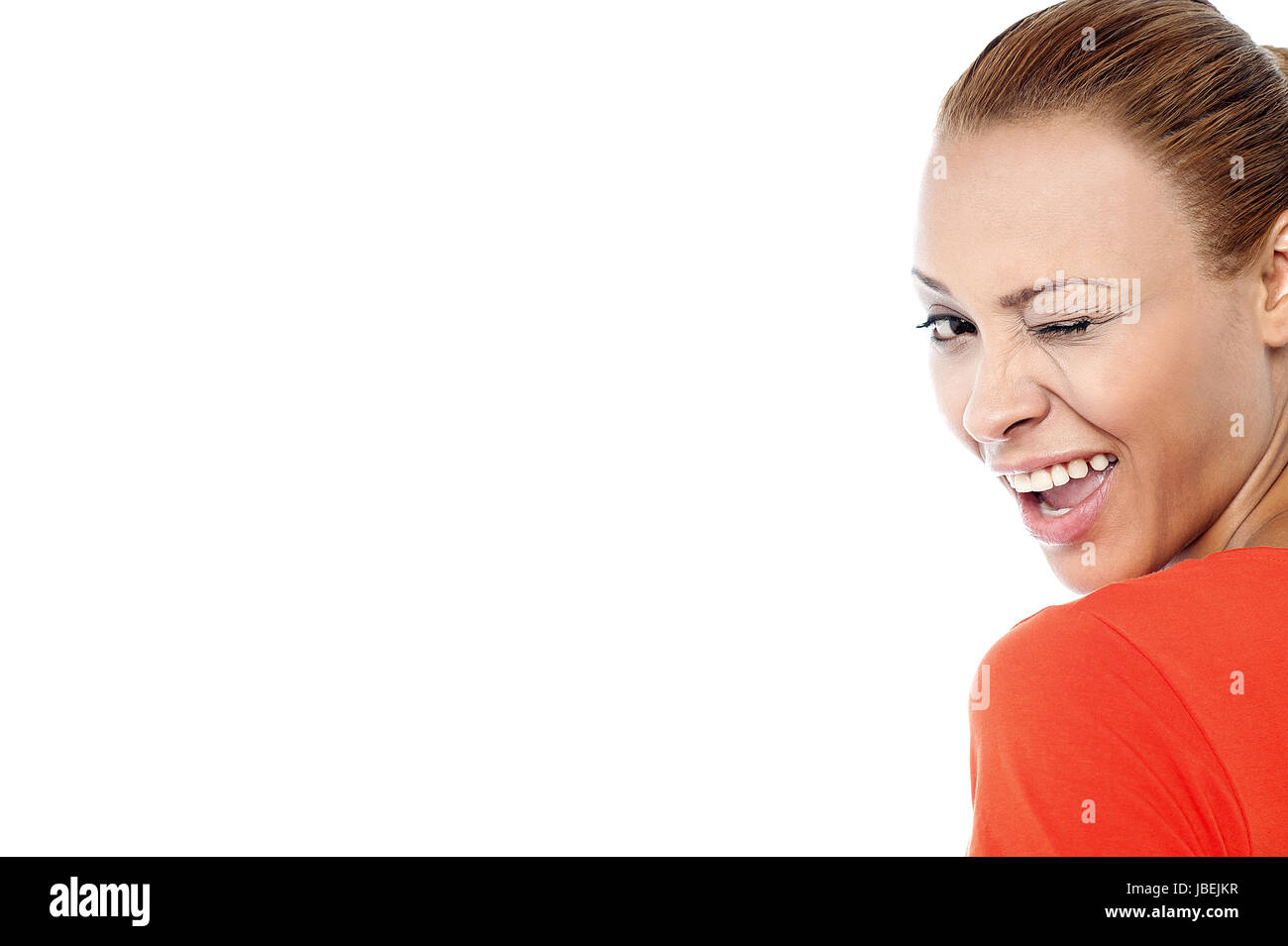 Pretty young lady winking, isolated on white Stock Photo - Alamy