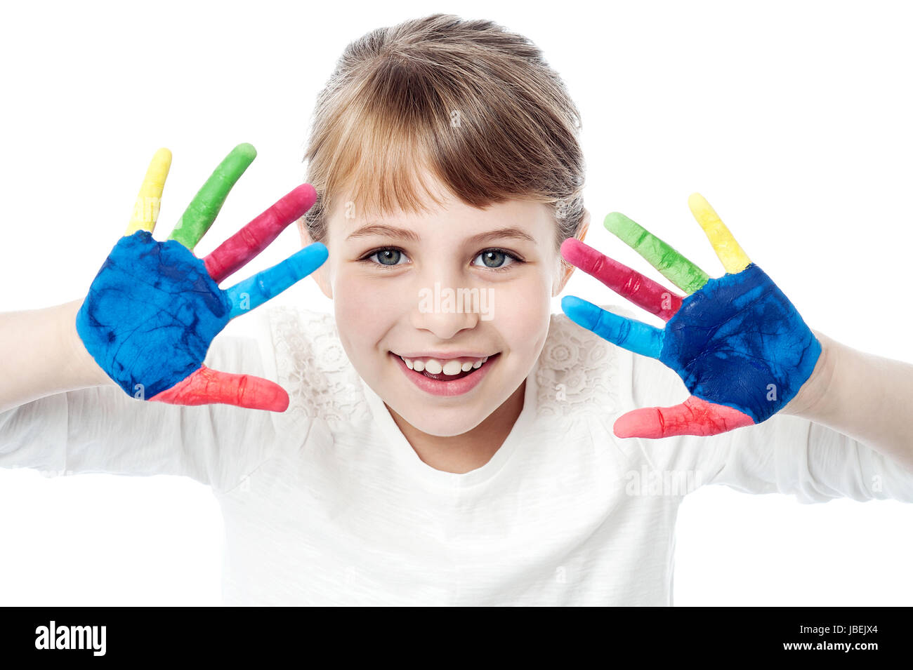 Attractive little girl with colorful hands Stock Photo - Alamy