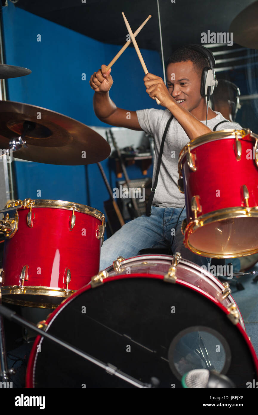 Cheerful guy playing drums hi-res stock photography and images - Alamy