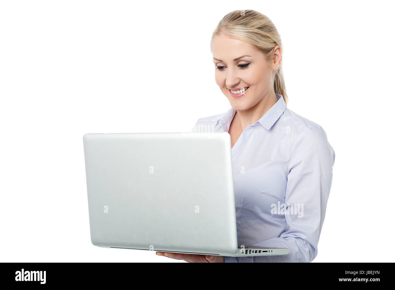 Corporate lady busy working on her laptop Stock Photo - Alamy