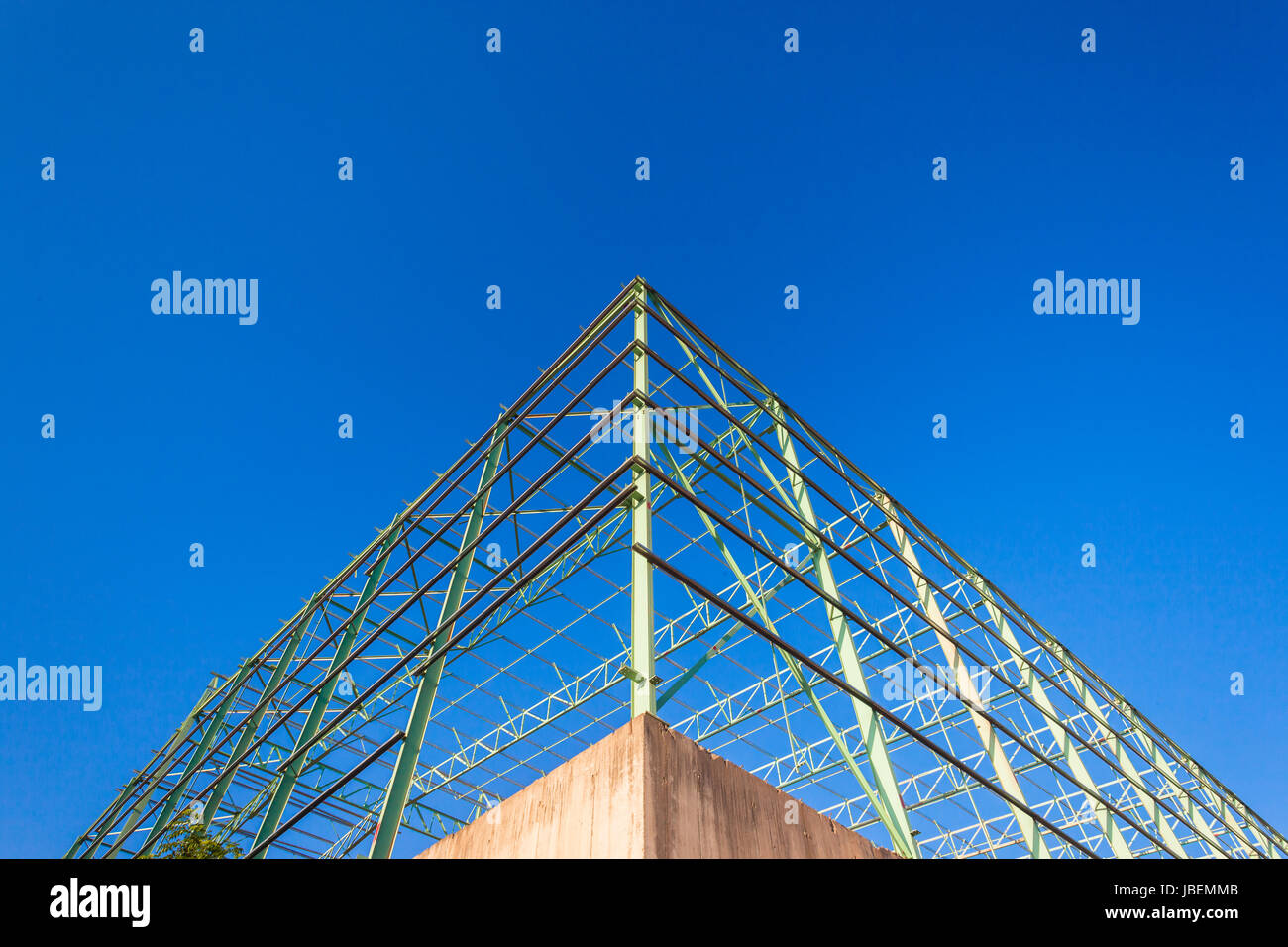 Steel frame warehouse building structure being put together piece by ...