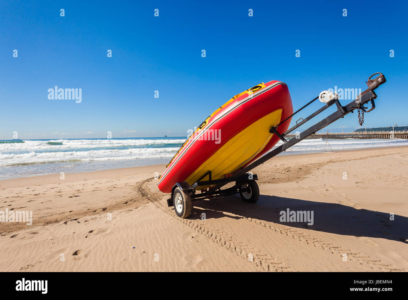 Lifeguard equipment surf rubber boat on ocean beach sands for rescue ...