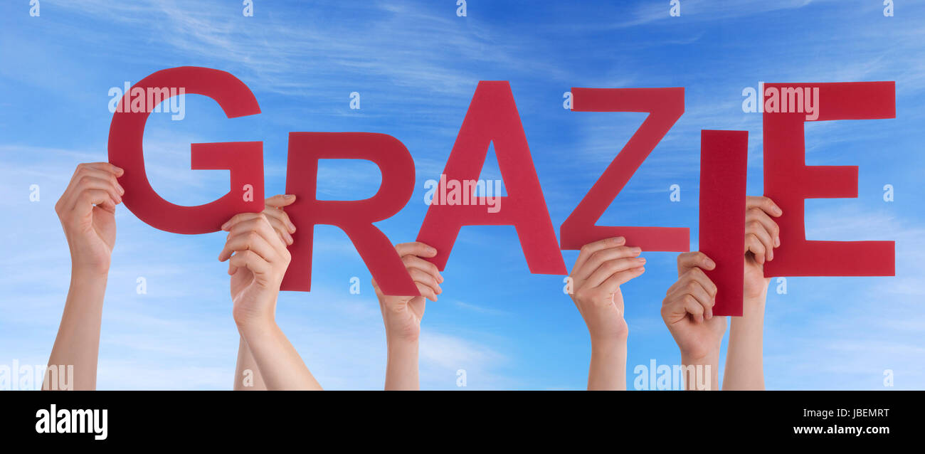 Many Hands Holding the Italian Word Grazie, which means Thanks, in the ...