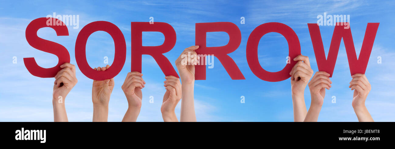 Many People Holding the Word Sorrow in the Sky Stock Photo - Alamy