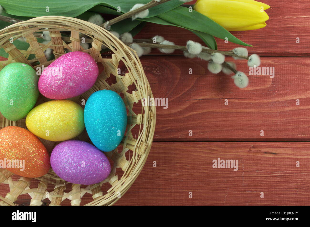 colored easter eggs in the basket Stock Photo - Alamy