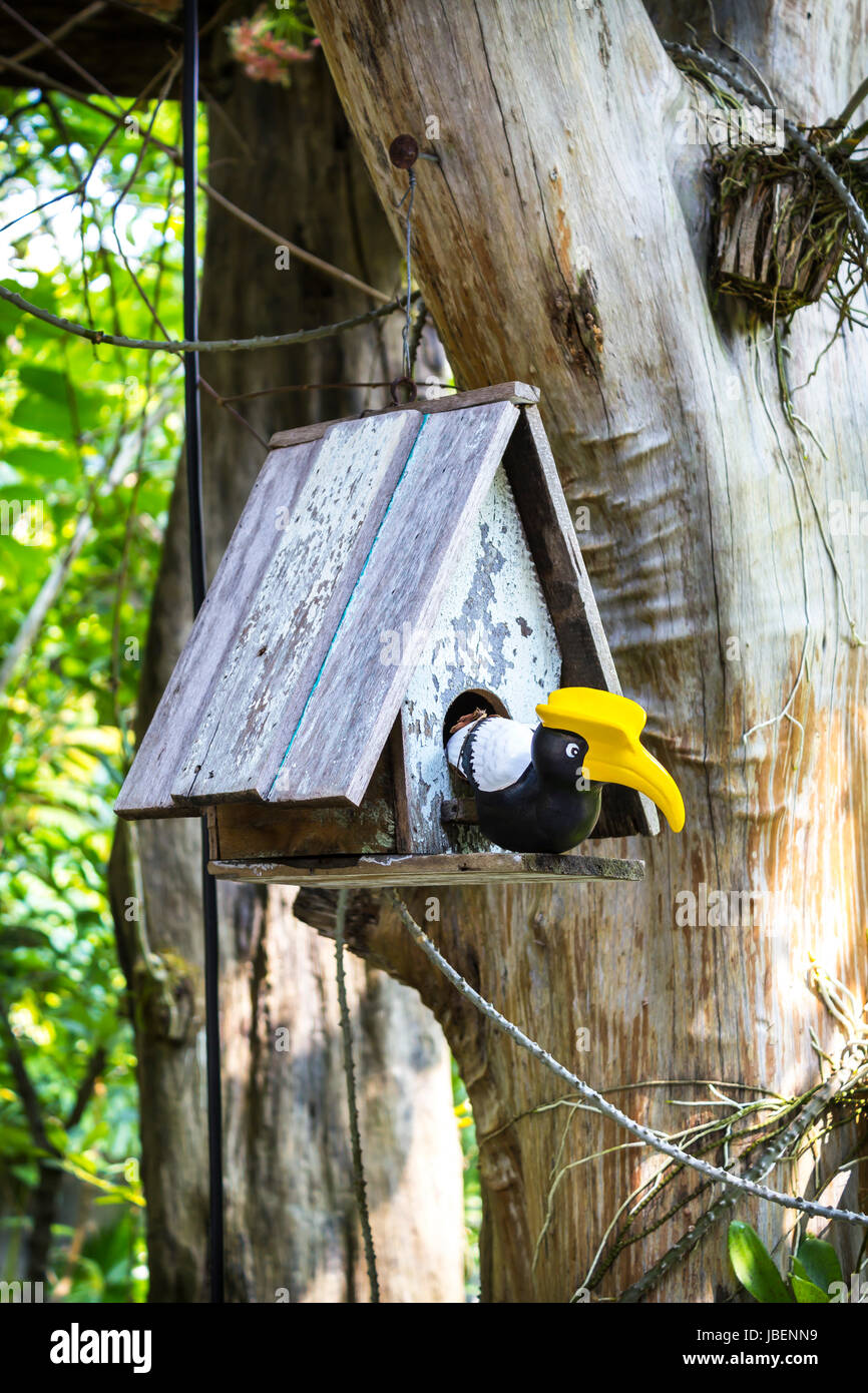 Closeup a bird house hanging on the tree with wooden bird Stock Photo ...