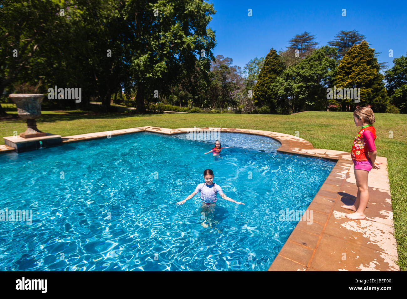 Children Playing In Swimming Pool Outdoors Summer Stock Photo - Alamy