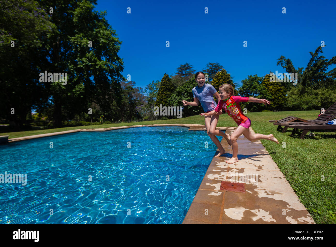 Children Playing In Swimming Pool Outdoors Summer Stock Photo - Alamy