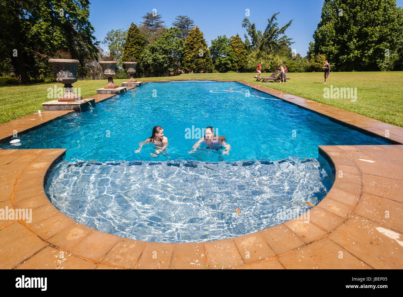 Children Playing In Swimming Pool Outdoors Summer Stock Photo - Alamy