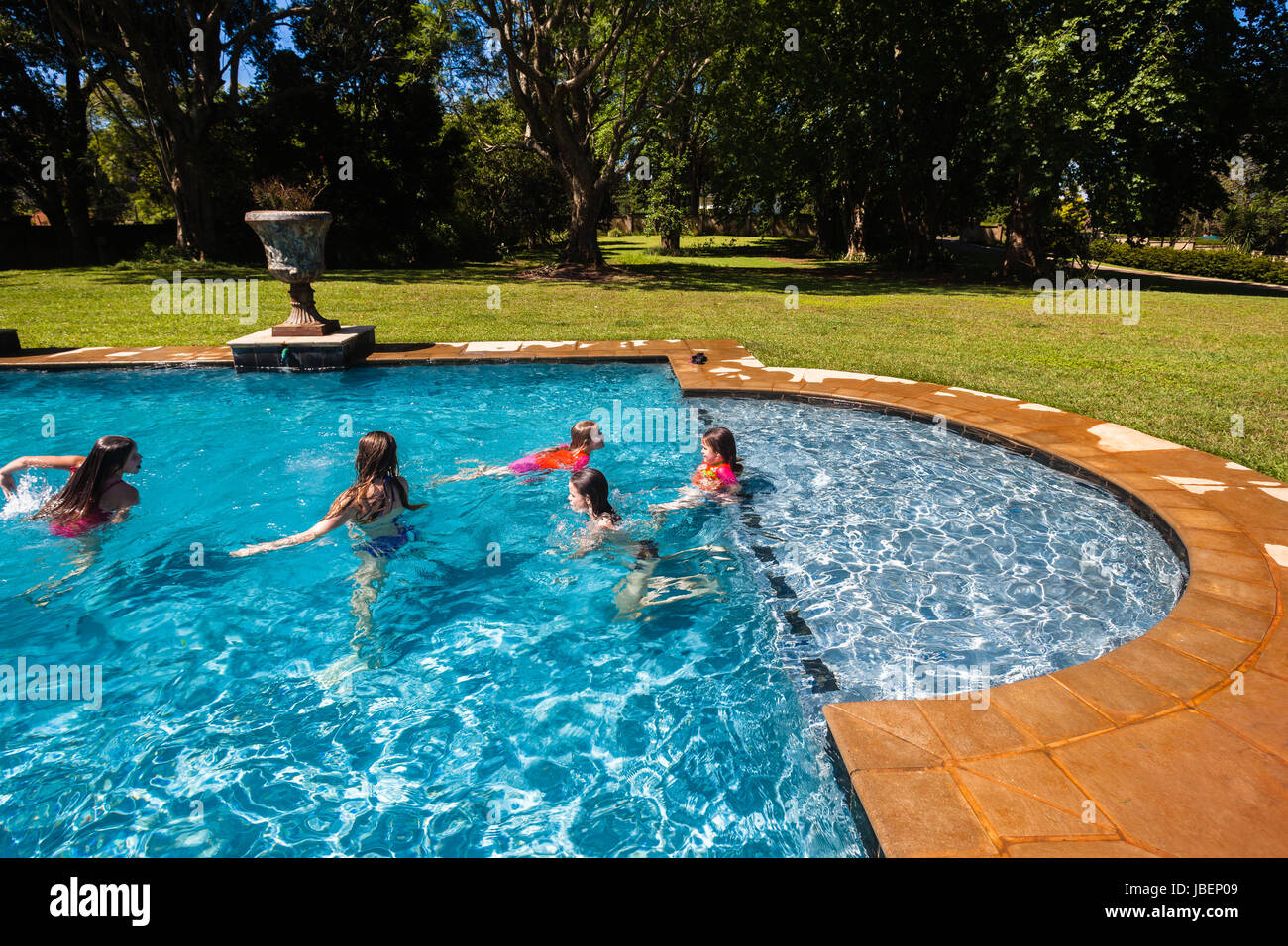 Children Playing In Swimming Pool Outdoors Summer Stock Photo - Alamy