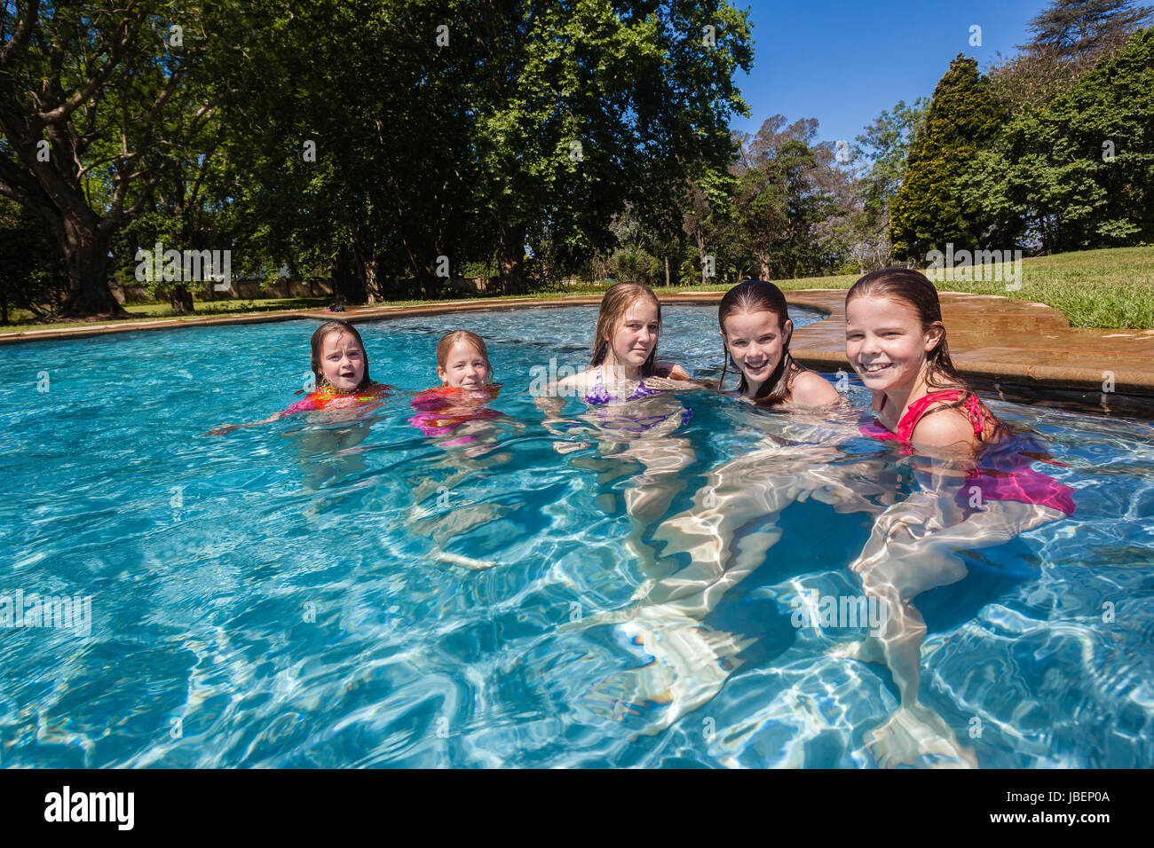 Children Playing In Swimming Pool Outdoors Summer Stock Photo - Alamy