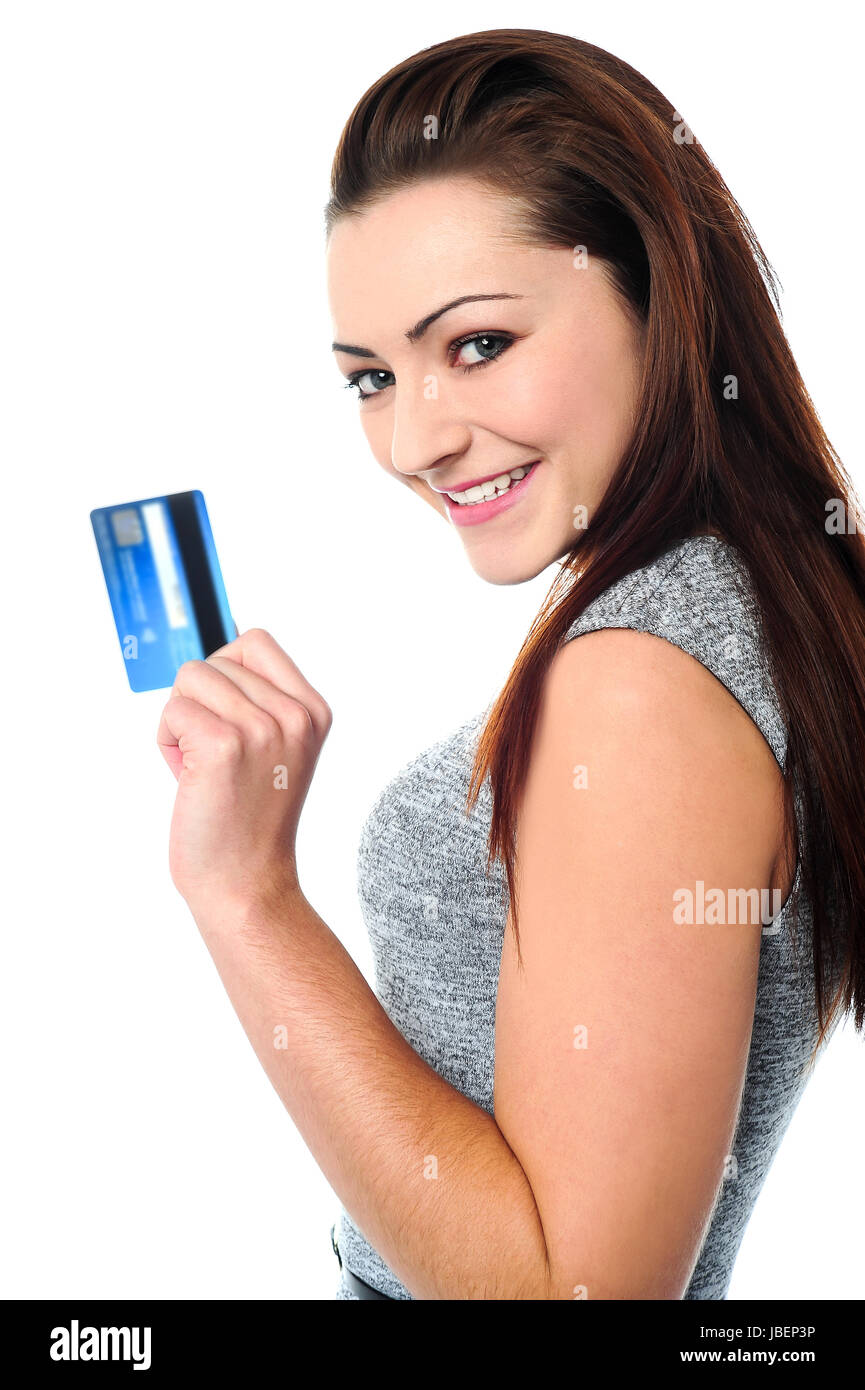 Stylish girl showing her credit card to camera Stock Photo - Alamy