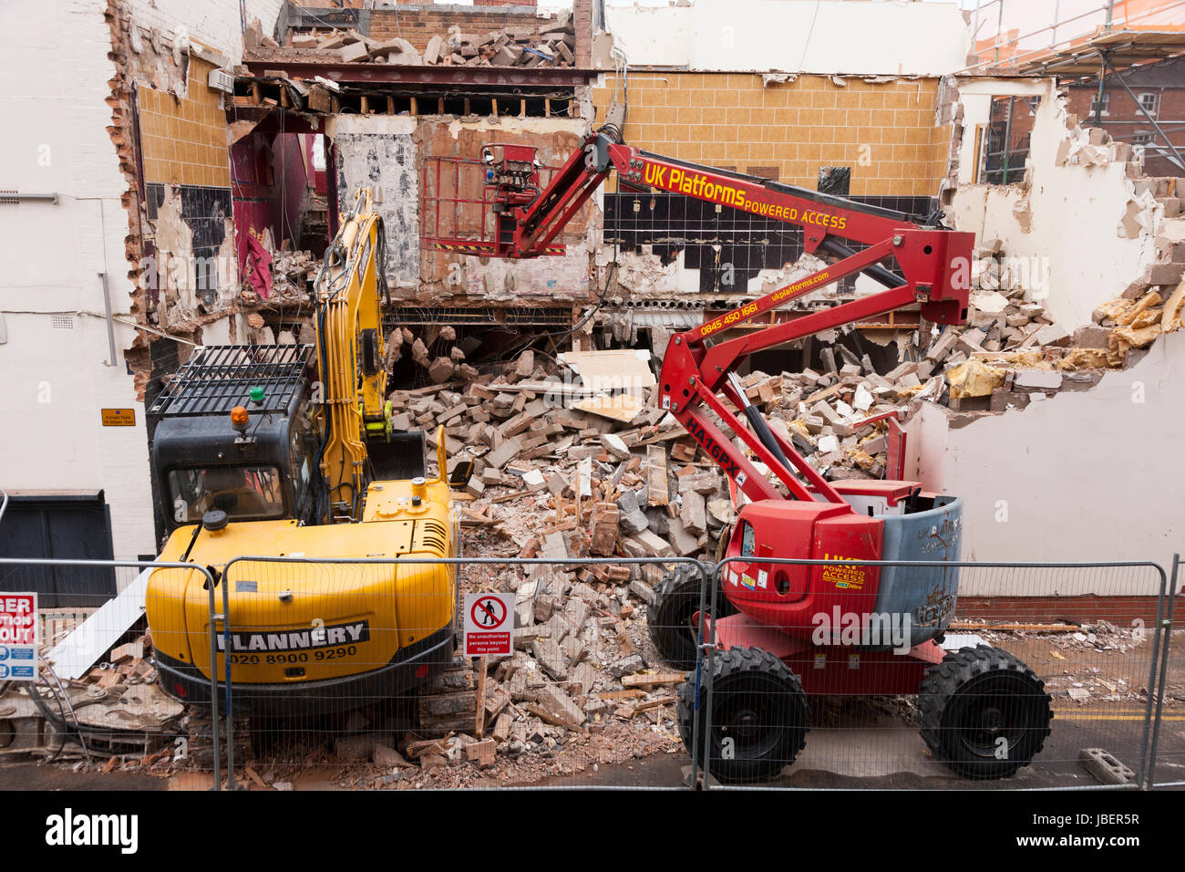 Demolition site with tracked digger, crane heavy hydraulic equipment in ...
