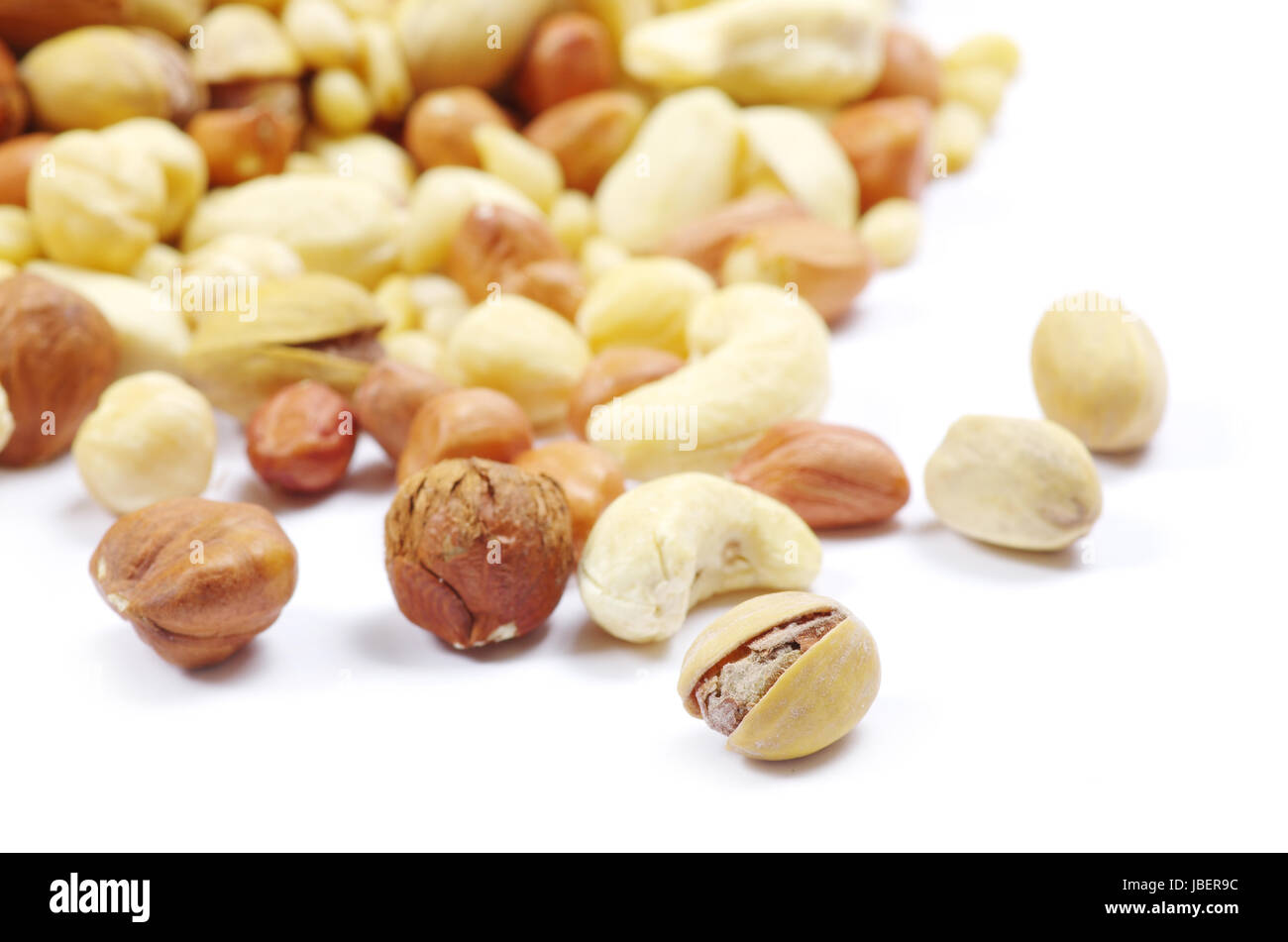 Assorted mixed nuts on white background Stock Photo - Alamy