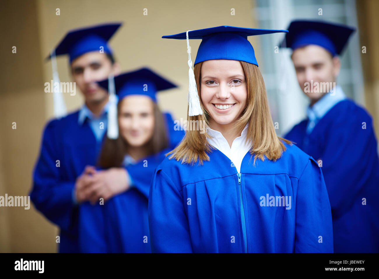 Cute girl in graduation gown hi-res stock photography and images - Alamy