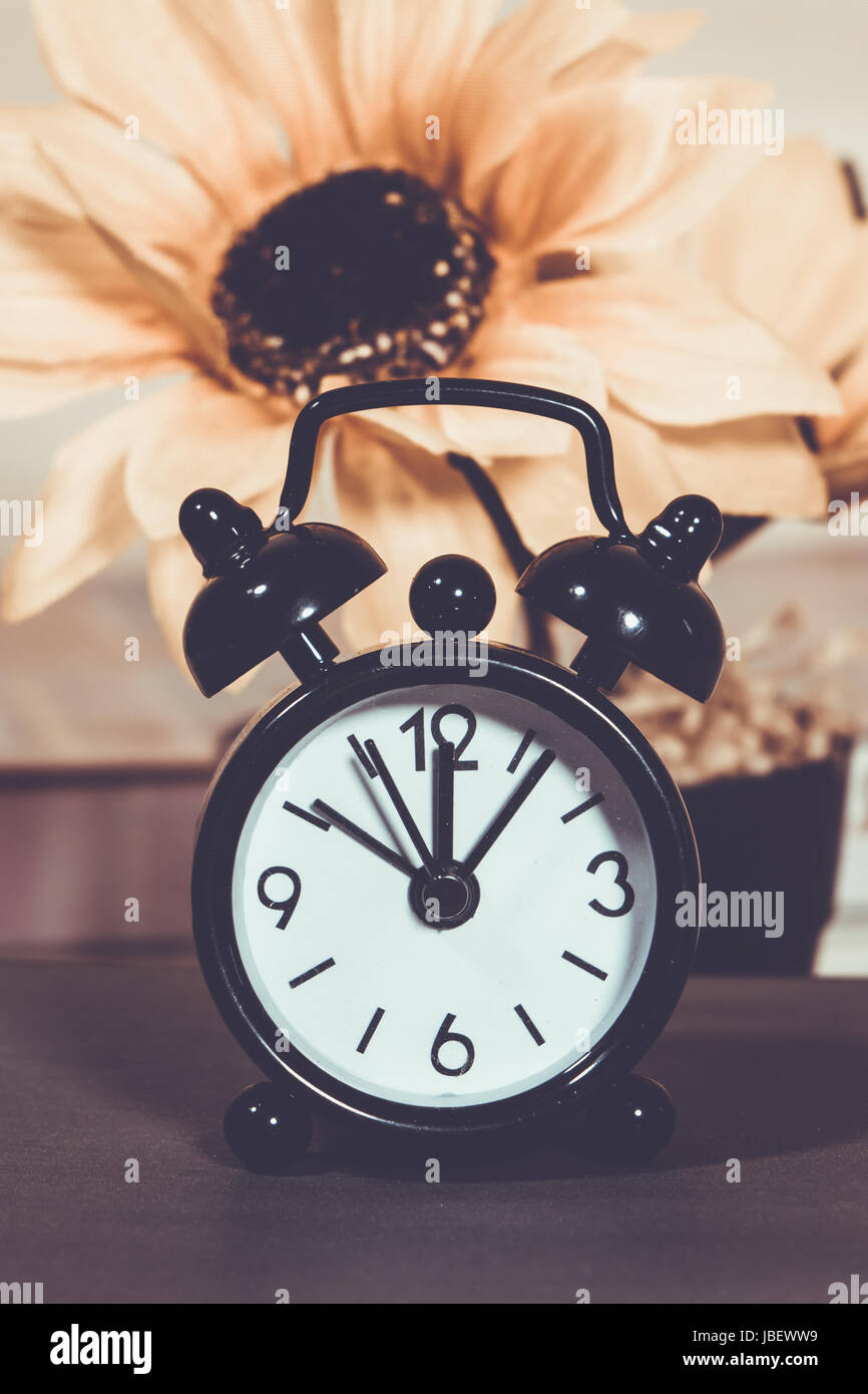 Alarm clock tells the time in daily life Stock Photo - Alamy