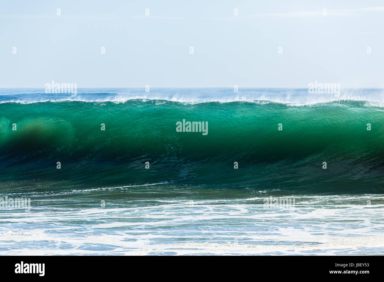 Surfers surfing cyclone swells of size at North New Piers Durban Stock ...