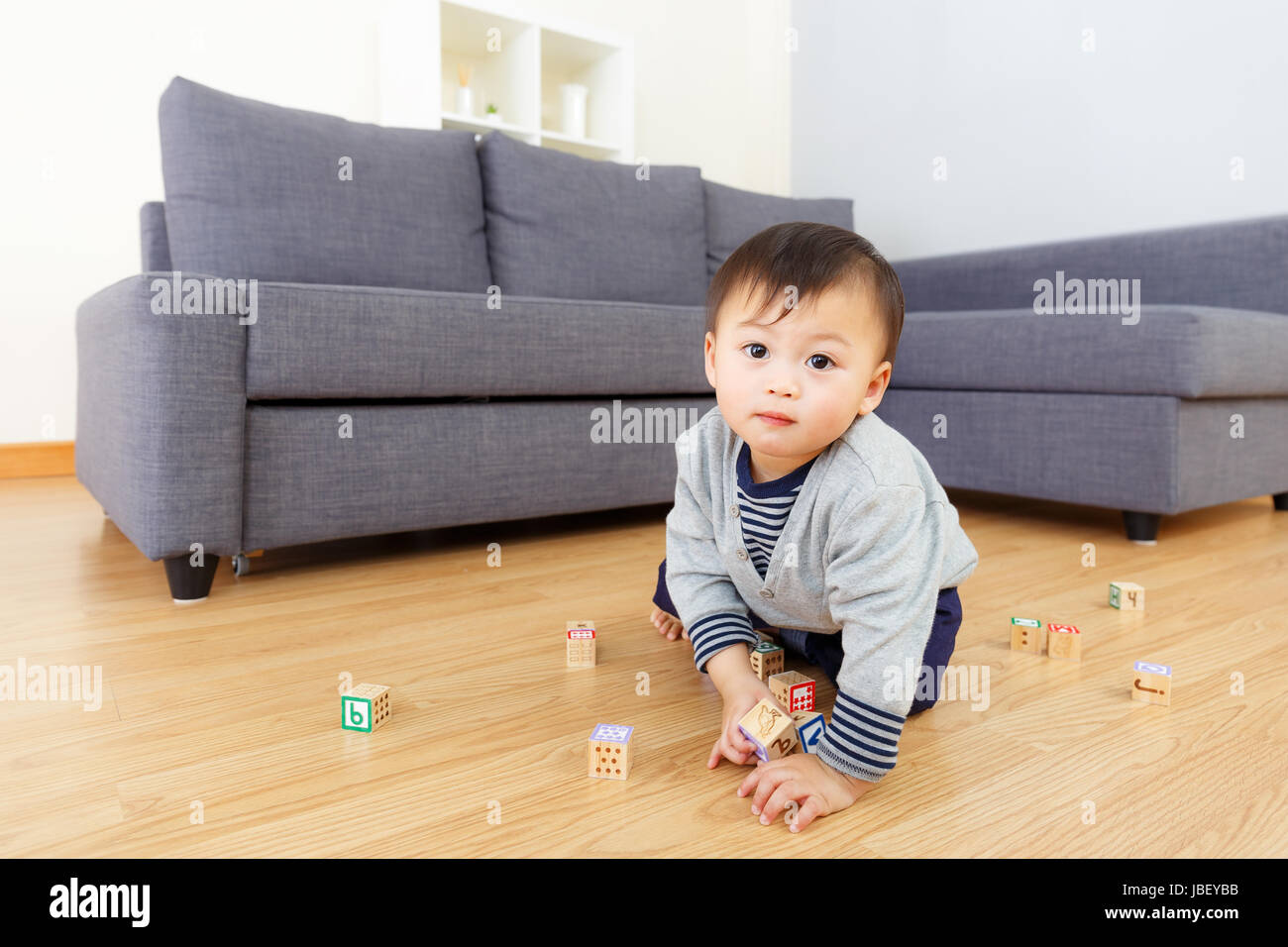 Aisa baby boy play toy block at home Stock Photo - Alamy