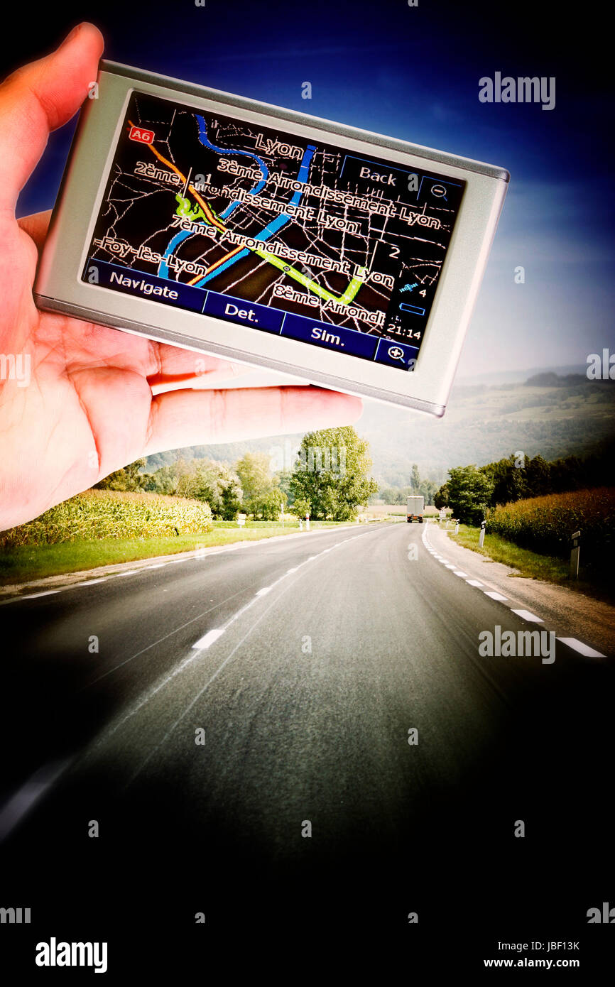 GPS Vehicle navigation system in a man hand Stock Photo - Alamy