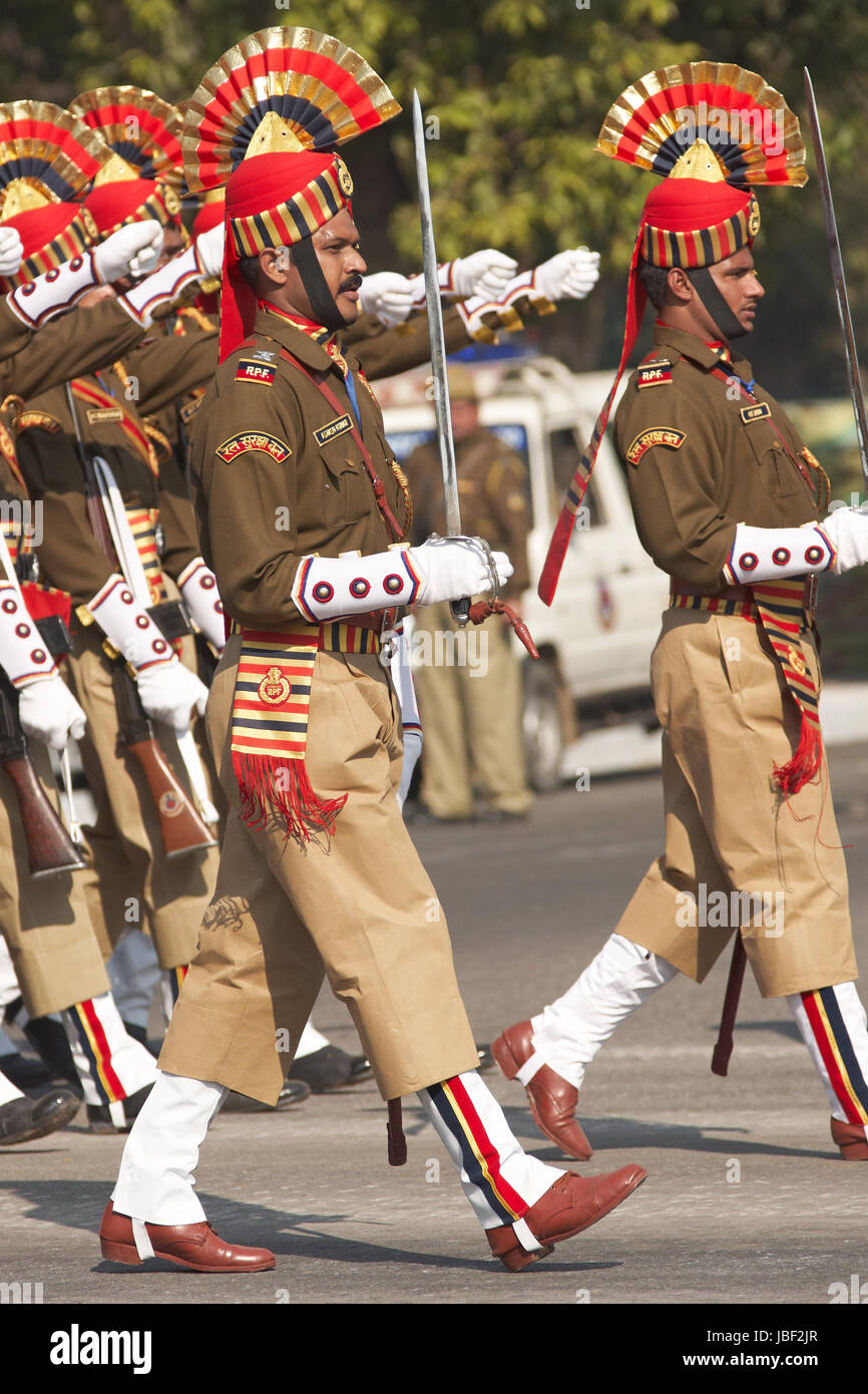 Soldiers in brightly coloured uniforms parading down the Raj Path in ...
