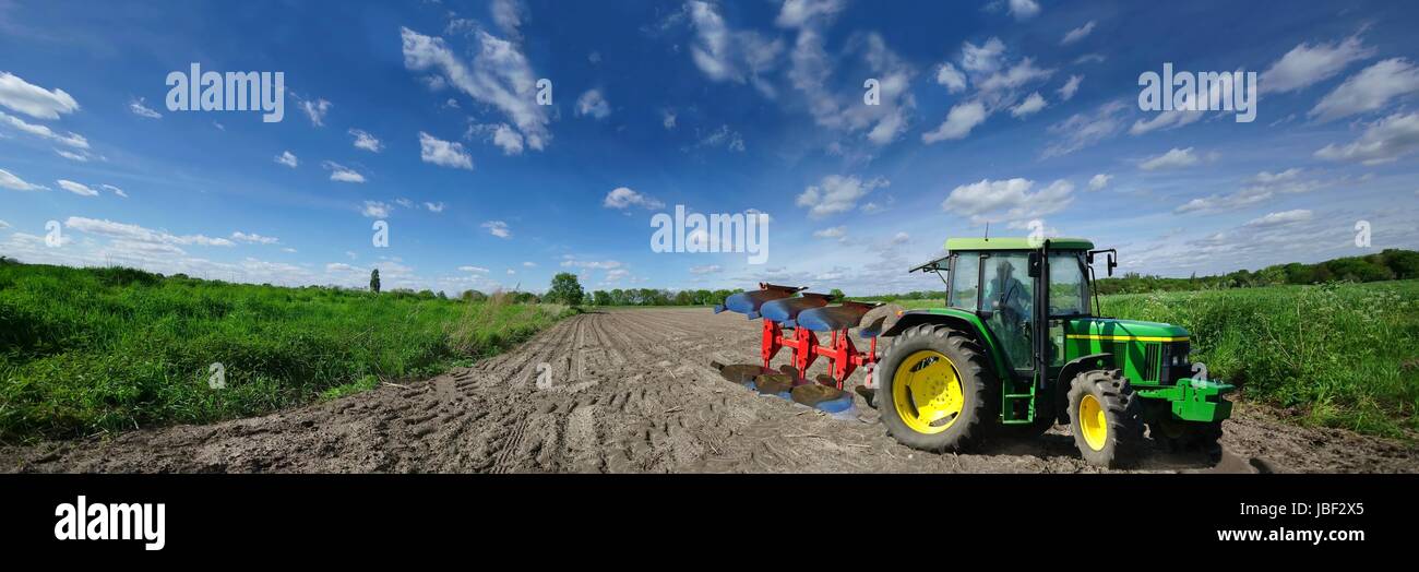 tractor tractor on the panoramic field Stock Photo - Alamy