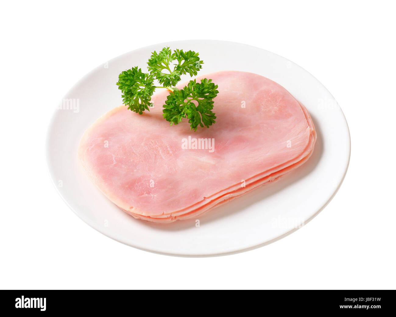 Thinly sliced ham on plate Stock Photo - Alamy