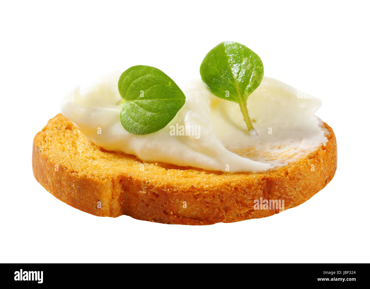 Small round toast with cheese spread Stock Photo - Alamy