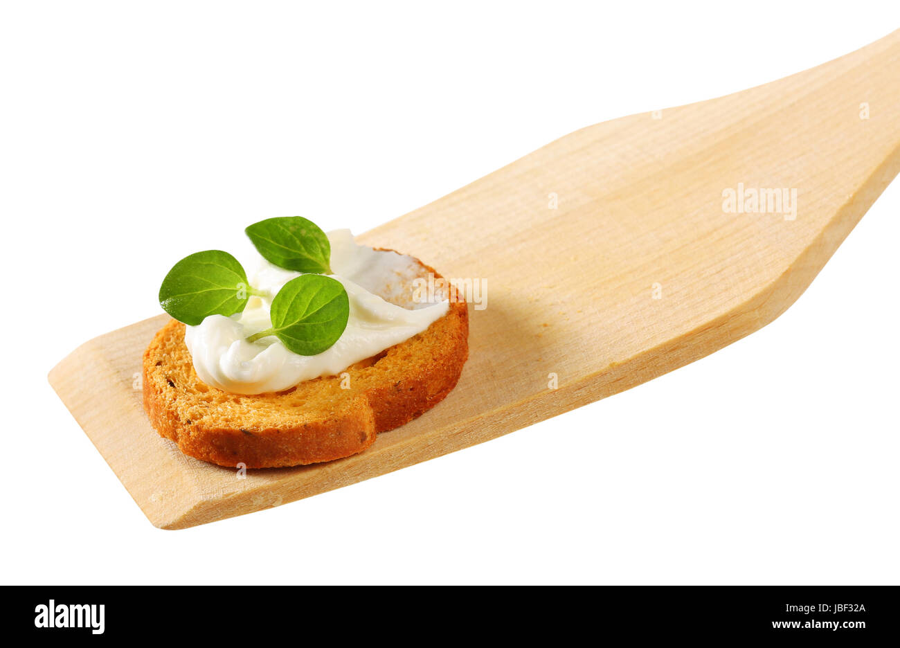 Small round toast with cheese spread Stock Photo - Alamy