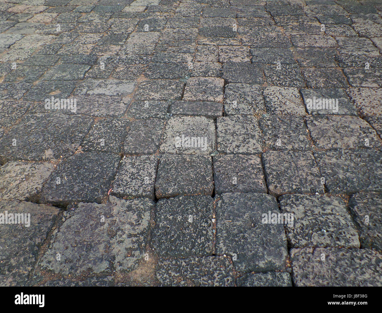 Dark and light gray tone of ancient rough stone floor of Prasat Hin ...
