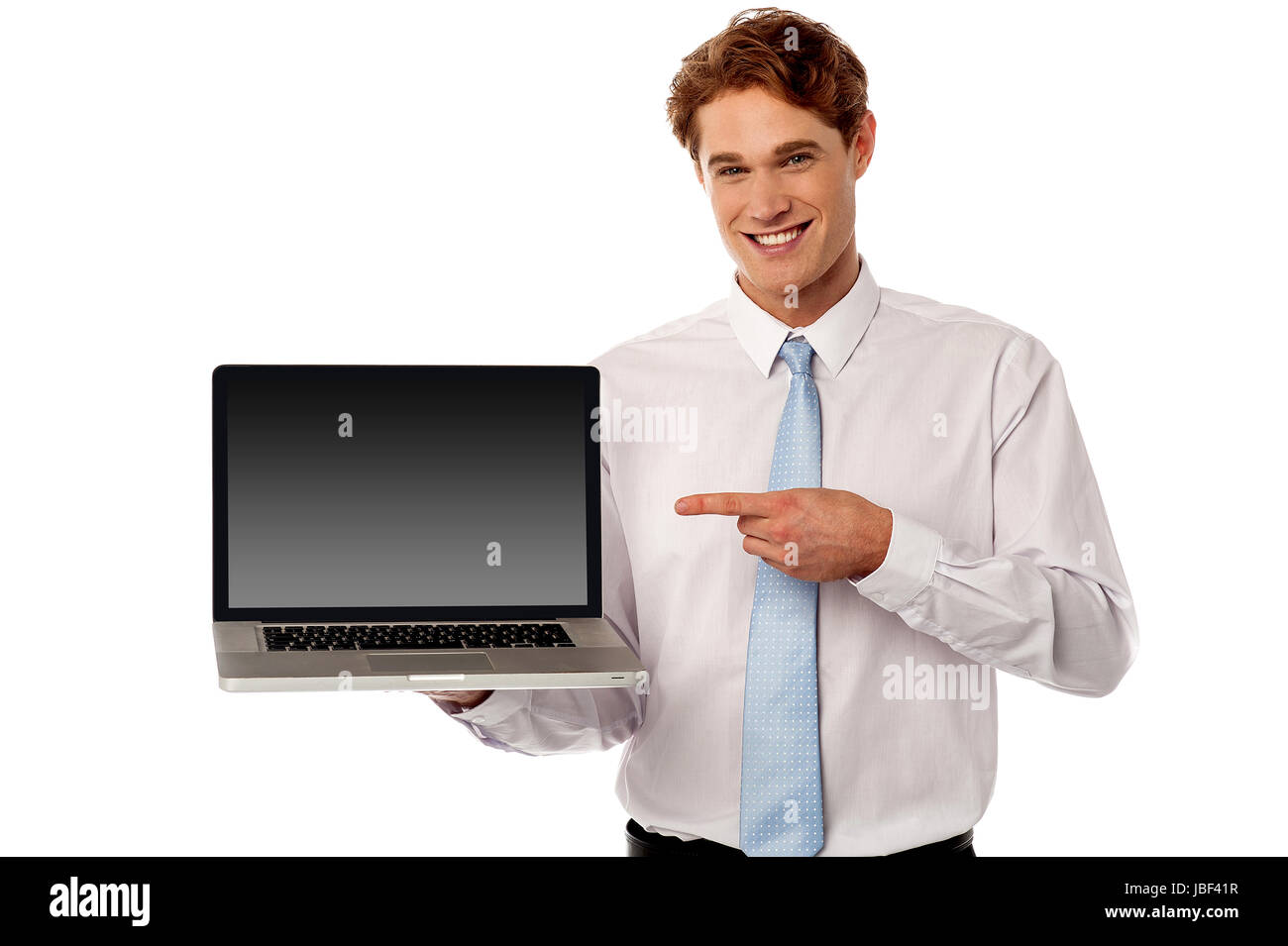 Salesman presenting brand new laptop Stock Photo - Alamy