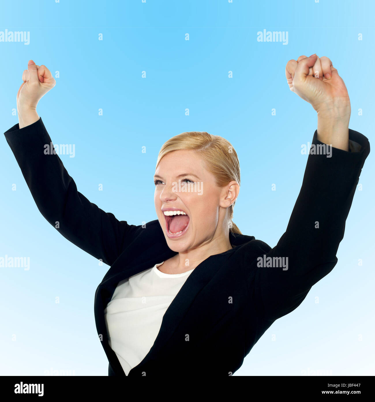 Successful businesswoman raising arms victory hi-res stock photography ...