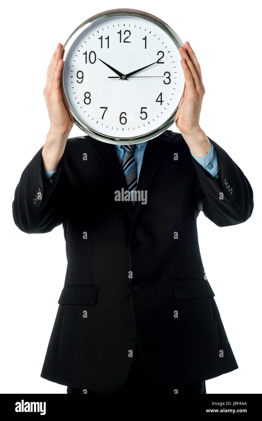 Man holding wall clock in front of his face Stock Photo - Alamy