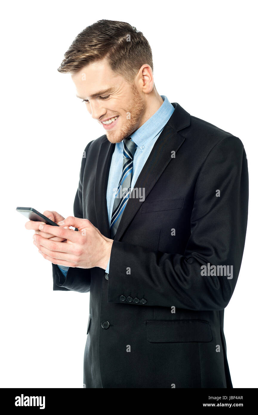 Corporate guy sending text message Stock Photo - Alamy