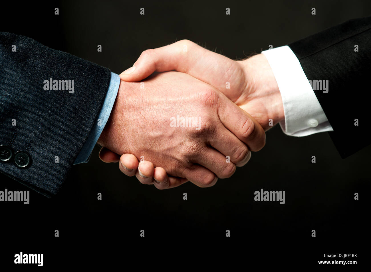 Business handshake after striking a deal Stock Photo - Alamy