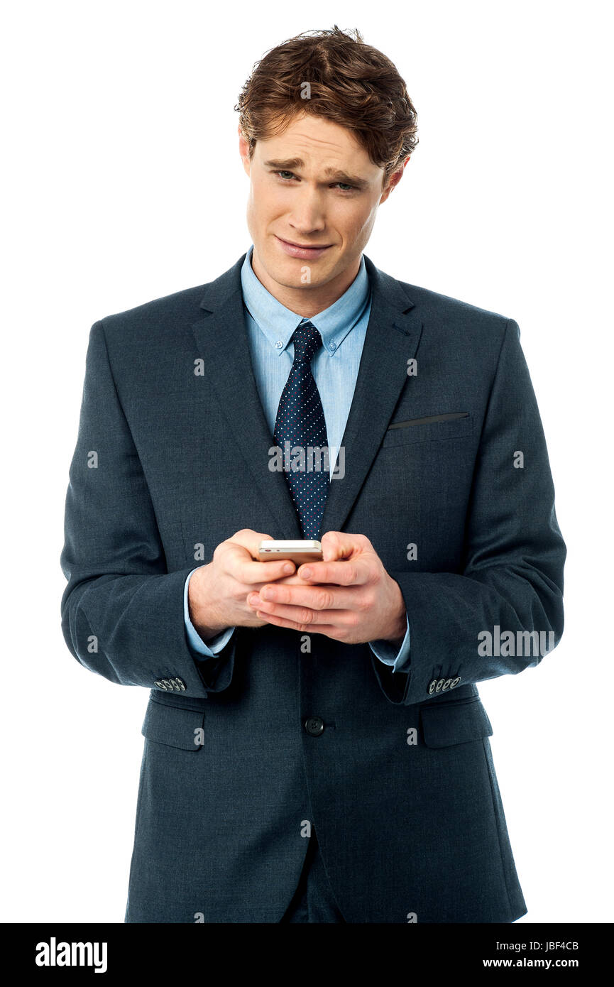 Corporate male executive messaging Stock Photo - Alamy