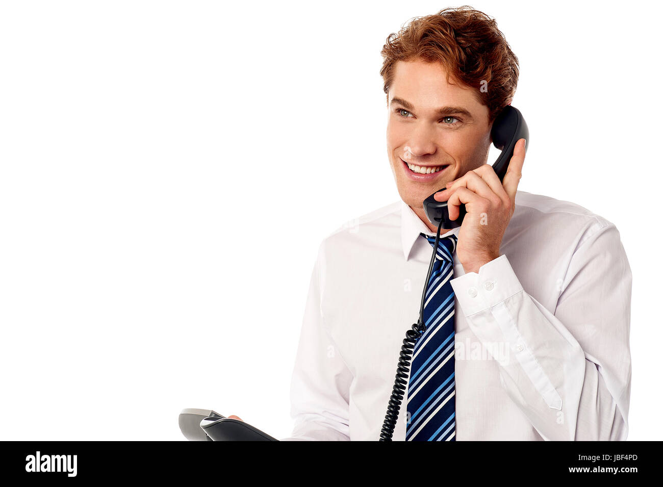 Handsome male executive attending phone call Stock Photo - Alamy