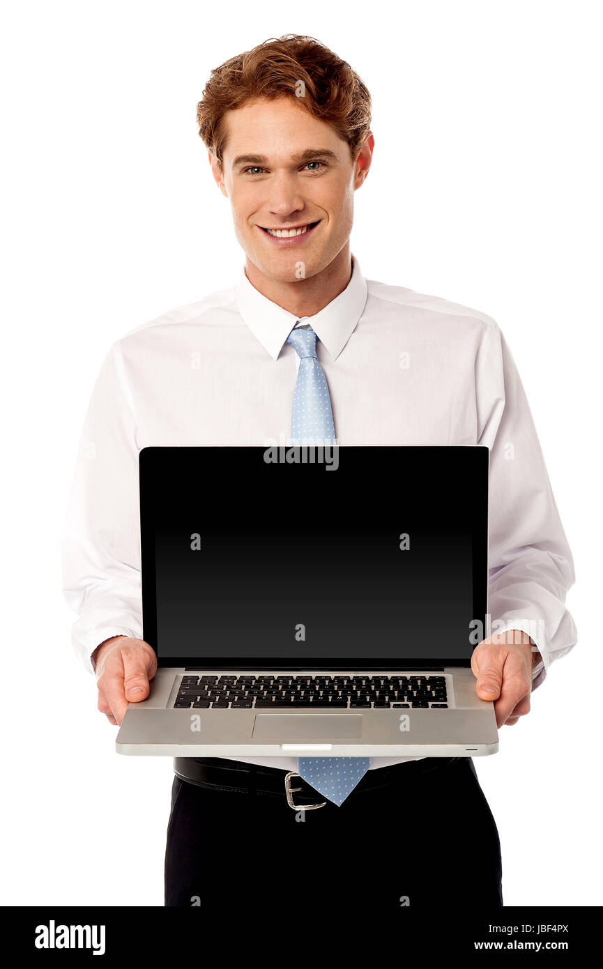 Salesman presenting brand new laptop Stock Photo - Alamy