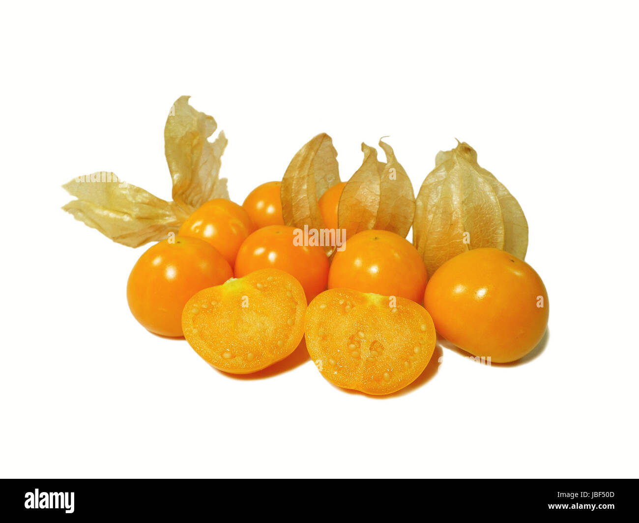 Bunch of bright orange yellow ripe Cape gooseberries, some with calyx ...