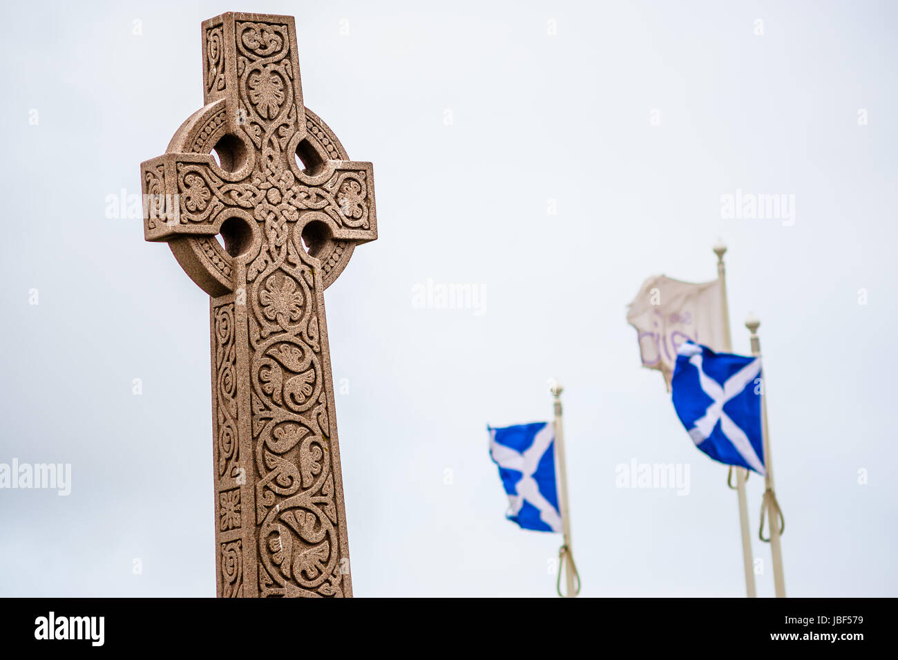 Old style celtic cross with visible national flags of Scotland - St ...