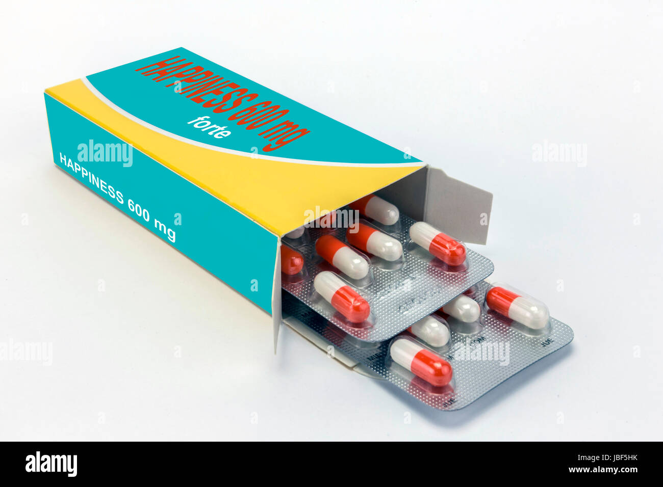 Open medicine packet labelled happiness opened at one end to display a ...