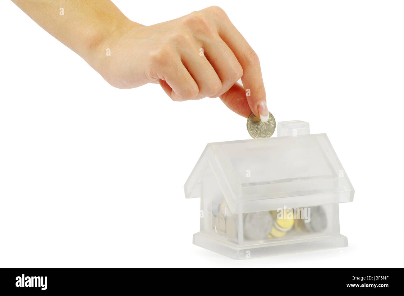 Hand with coin and house bank isolated on white background Stock Photo ...