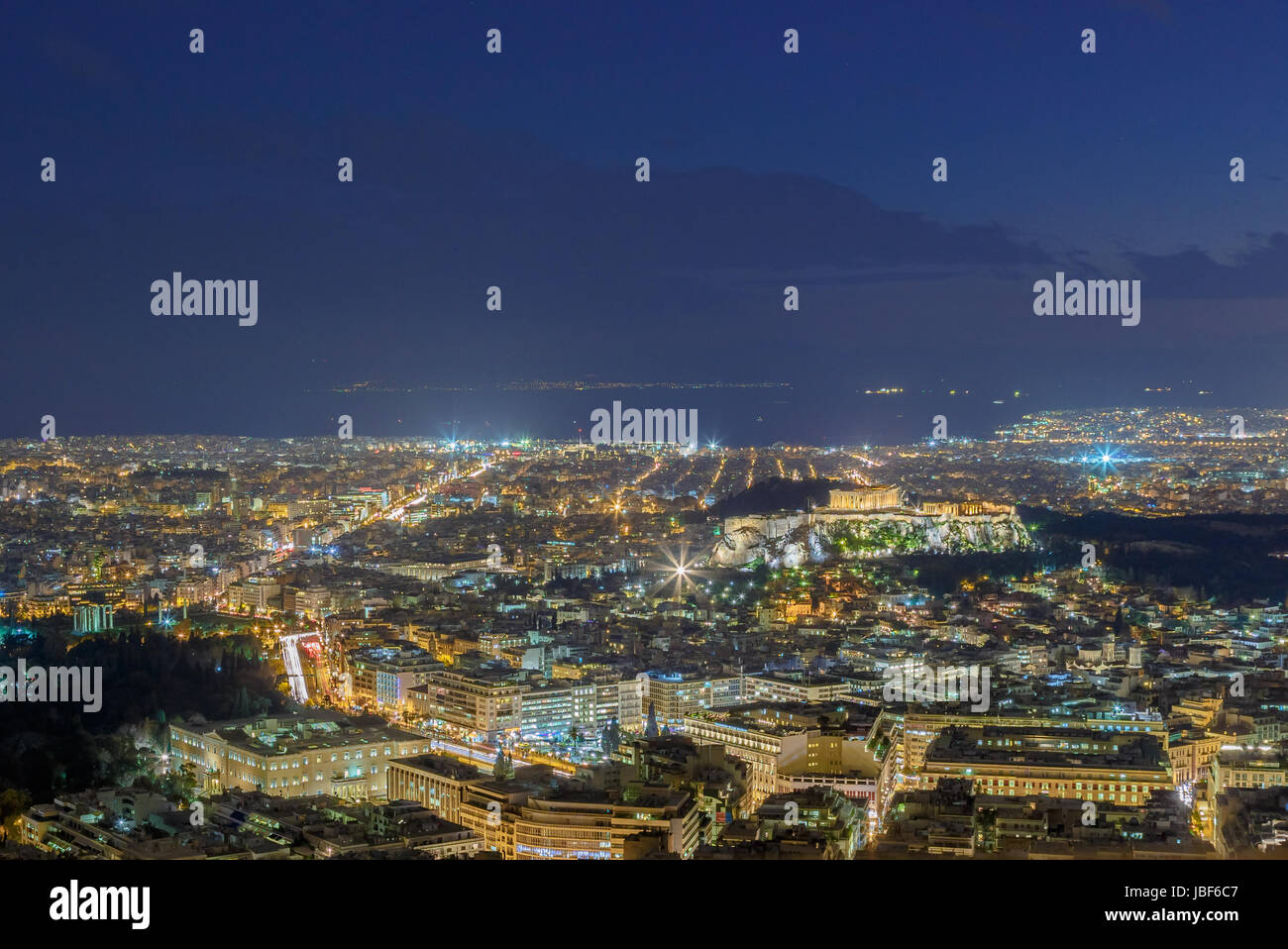 Athens skyline aerial view in the afternoon with the lights over blue ...