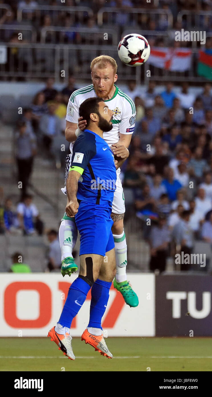 Northern Ireland's Liam Boyce wins a header during the 2018 FIFA World ...