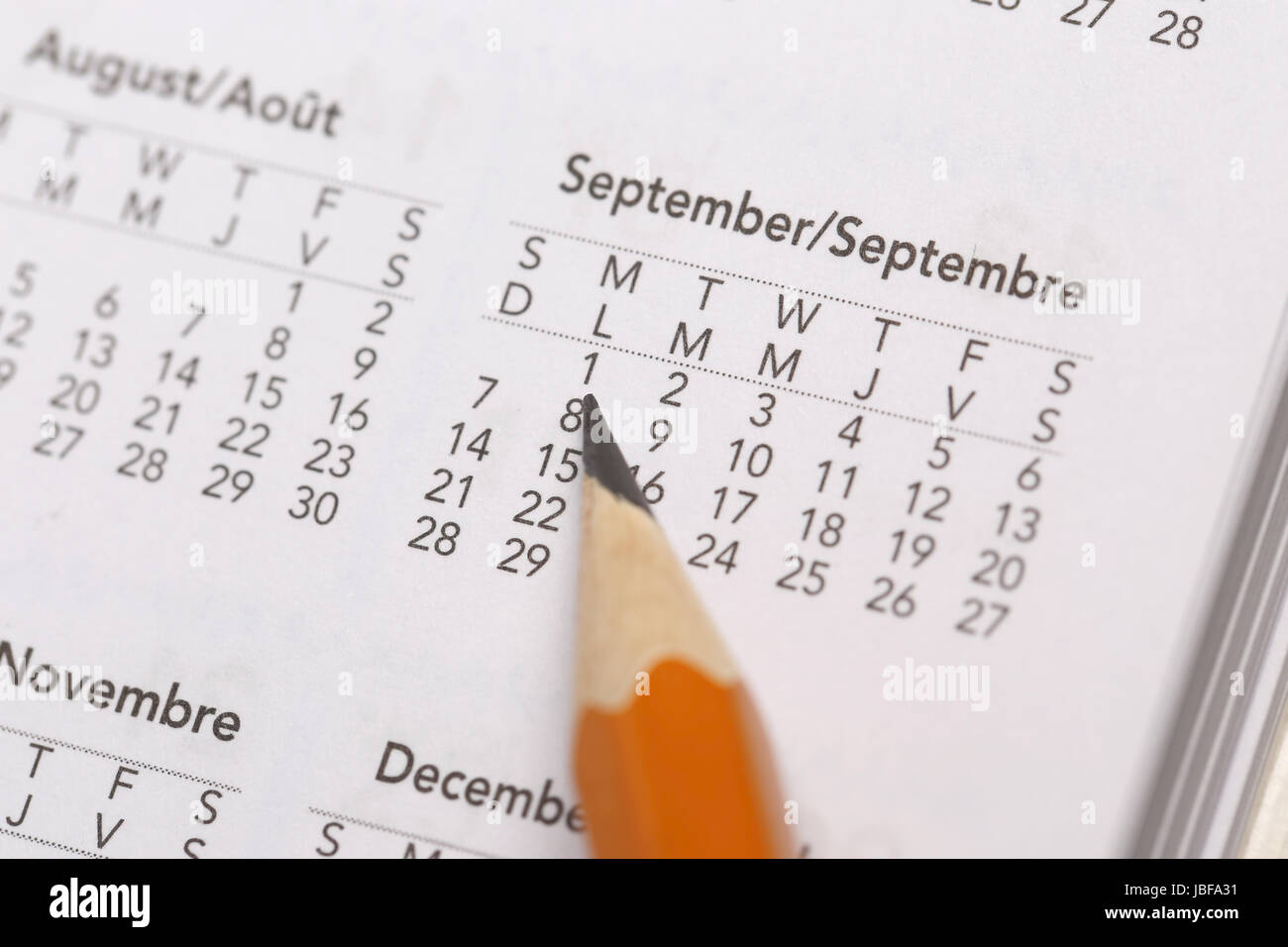 Pointing date on calendar Stock Photo - Alamy
