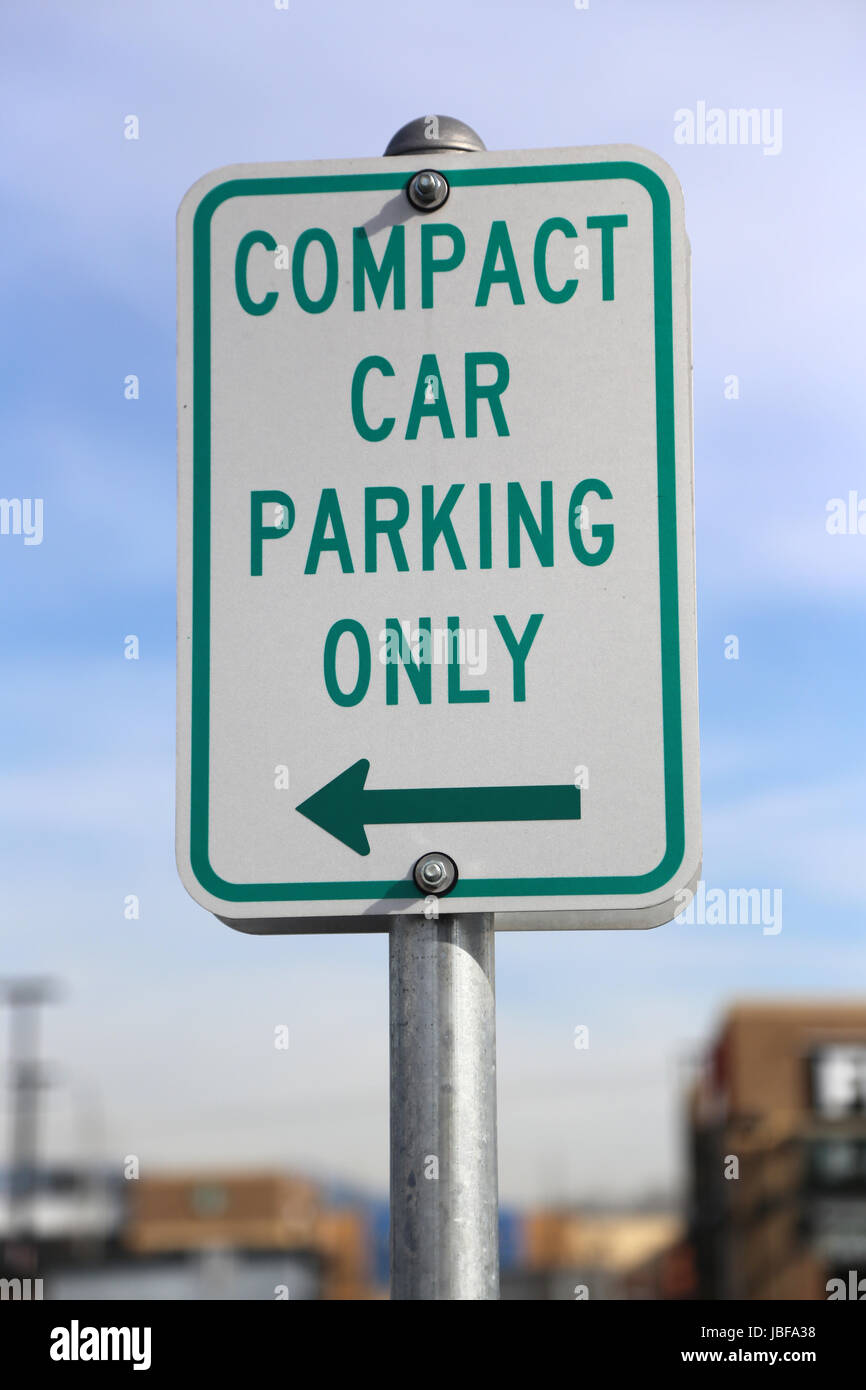 Compact car parking only sign Stock Photo - Alamy