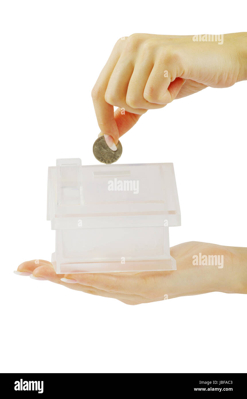 Hand with coin and house bank isolated on white background Stock Photo ...